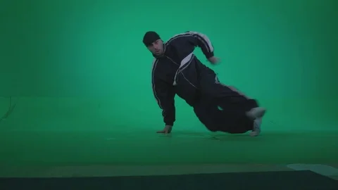 man dancing break dance on green screen | Stock Video | Pond5