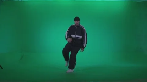 man dancing break dance on green screen | Stock Video | Pond5