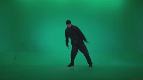 man dancing break dance on green screen | Stock Video | Pond5