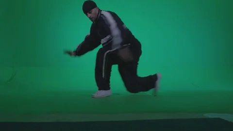 man dancing break dance on green screen | Stock Video | Pond5