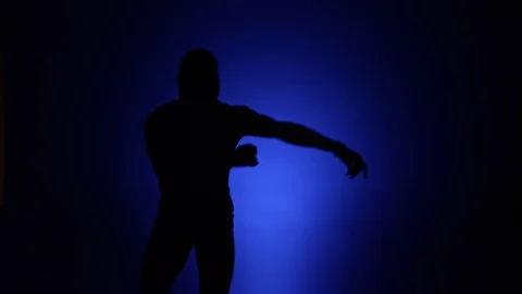 man dancing silhouette blue background 2 | Stock Video | Pond5
