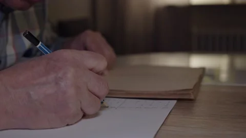 Man decoding morse code with an old book... | Stock Video | Pond5