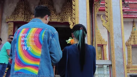 A man in a denim jacket with an lgbt fla... | Stock Video | Pond5