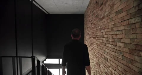The man descends the stairs in the house... | Stock Video | Pond5