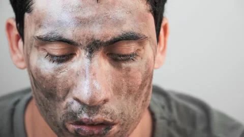Man with Dirty Face is looking at the ca... | Stock Video | Pond5