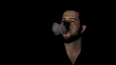 Man disappearing behind cigarette smoke,... | Stock Video | Pond5