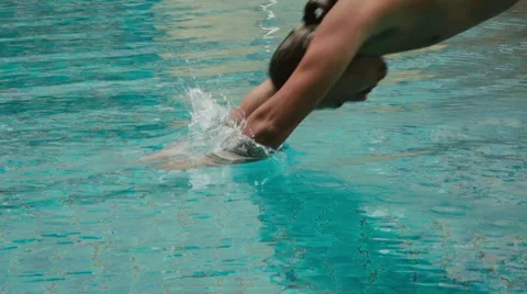 man diving into a swimming pool | Stock Video | Pond5