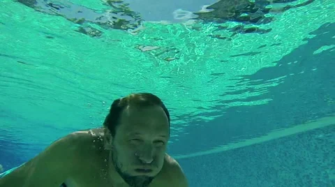 Man diving in the swimming pool, steadyc... | Stock Video | Pond5