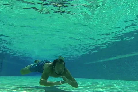 Man diving in the swimming pool, steadyc... | Stock Video | Pond5