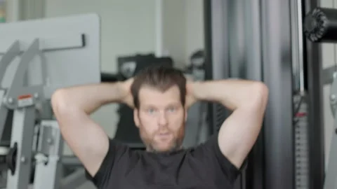 Man doing sit ups at the gym, physical f... | Stock Video | Pond5