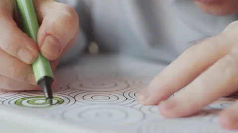 Man with Down Syndrome Drawing on Colori... | Stock Video | Pond5