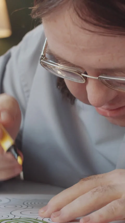 Man with Down Syndrome Drawing on Colori... | Stock Video | Pond5