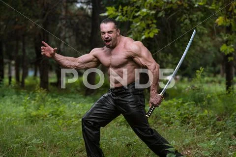 Man drawing ancient sword in self defense Stock Photo #43190370