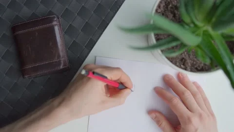 Man drawing a smiley face on a paper. To... | Stock Video | Pond5