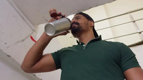 Man drinking protein with a holding prot... | Stock Video | Pond5