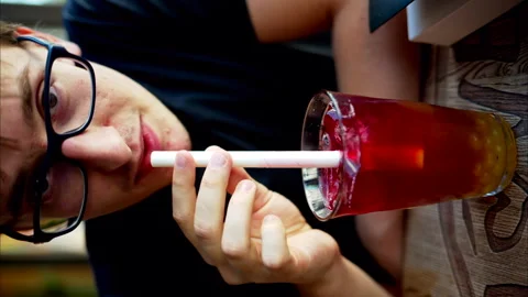 Man drinking red bubble tea with boba in... | Stock Video | Pond5