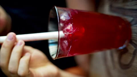Man drinking red bubble tea with boba in... | Stock Video | Pond5