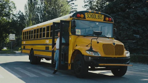 Man driver coming out schoolbus cabin. E... | Stock Video | Pond5