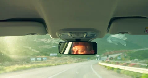 Man driving car fast in rear view mirror... | Stock Video | Pond5