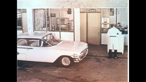 A man drops his Chevy off at a garage, a... | Stock Video | Pond5