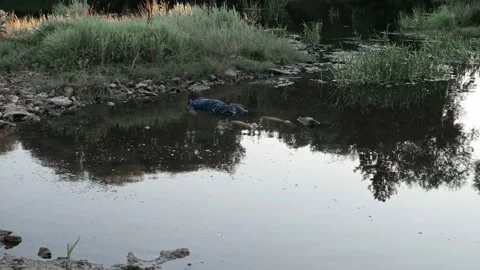 a man drowned , dead in the water , the ... | Stock Video | Pond5