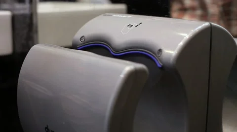 Man Drying Hands In Special Machine | Stock Video | Pond5