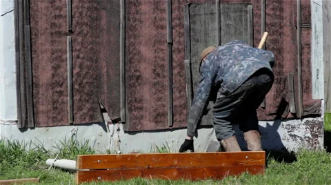 man dug a pit for bench | Stock Video | Pond5