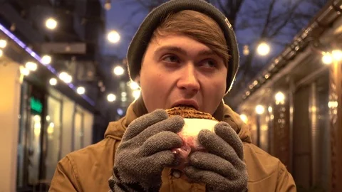 Man eating Doner Kebab at the night stre... | Stock Video | Pond5