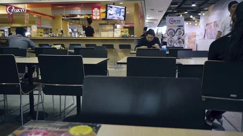 Man eating at food court with chef prepa... | Stock Video | Pond5