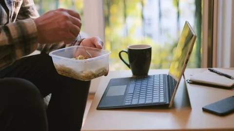 Man eating pasta from a plastic lunch bo... | Stock Video | Pond5