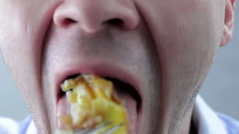Man eating potatoes.close-up, man eats, ... | Stock Video | Pond5
