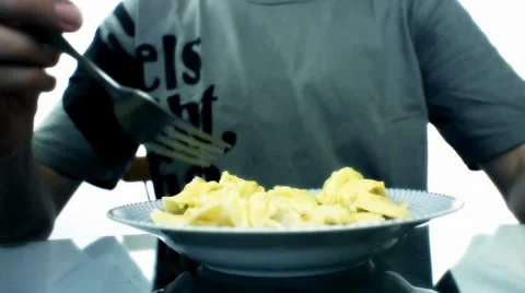 Man Eating Ravioli for Lunch on White Ba... | Stock Video | Pond5