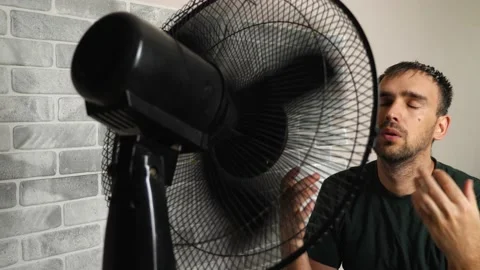 Man exhausted by the heat exposes his fa... | Stock Video | Pond5