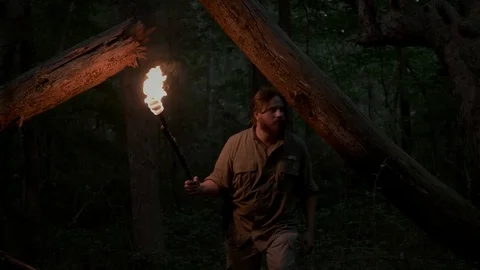 Man Exploring by Torch light | Stock Video | Pond5
