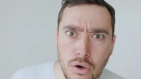 Man expressing surprise with wide eyes a... | Stock Video | Pond5