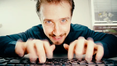 Man extreme fast typing and stare into c... | Stock Video | Pond5
