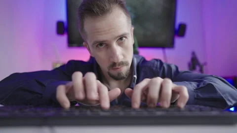 Man face over keyboard while typing fast... | Stock Video | Pond5