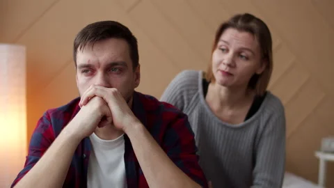 Man face red from tears sitting on bed w... | Stock Video | Pond5