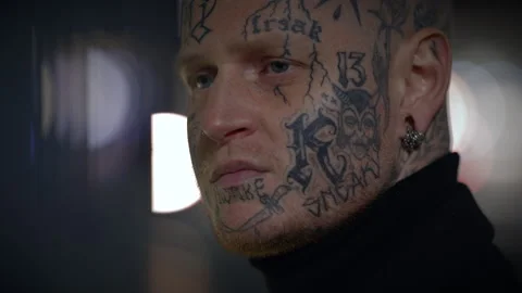 A man with face tattoos in urban setting... | Stock Video | Pond5