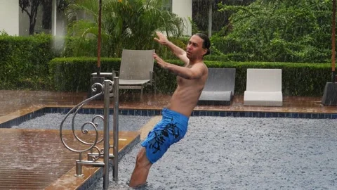 Man fall into water of swimming pool, pl... | Stock Video | Pond5