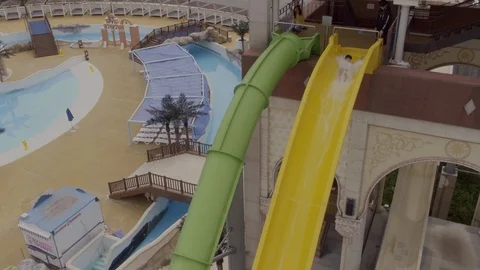 A man falling down in a water park slipp... | Stock Video | Pond5