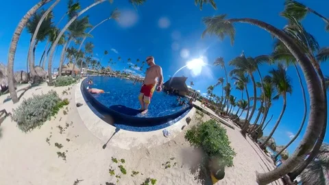 man falling into pool at resort | Stock Video | Pond5