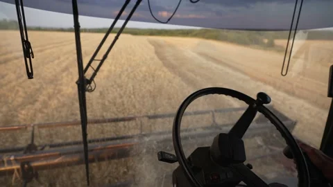 Man farm worker driving combine and harv... | Stock Video | Pond5