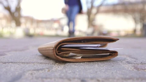man finds a lost wallet with money and d... | Stock Video | Pond5
