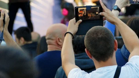 The man in front of the stage is filmin... | Stock Video | Pond5