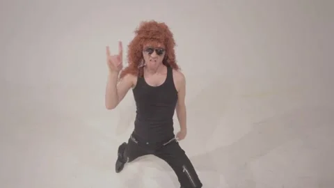 Man in a funny retro rock costume posing... | Stock Video | Pond5