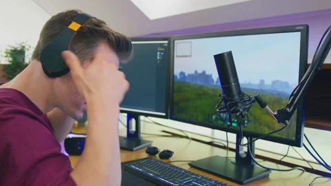 Man Gaming At Home Sitting At Desk Putti... | Stock Video | Pond5