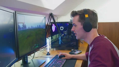 Man Gaming At Home Sitting At Desk Weari... | Stock Video | Pond5