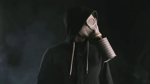 man in a gas mask in smoke in a dark roo... | Stock Video | Pond5
