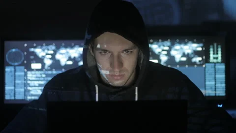 Man geek hacker in hood working at compu... | Stock Video | Pond5
